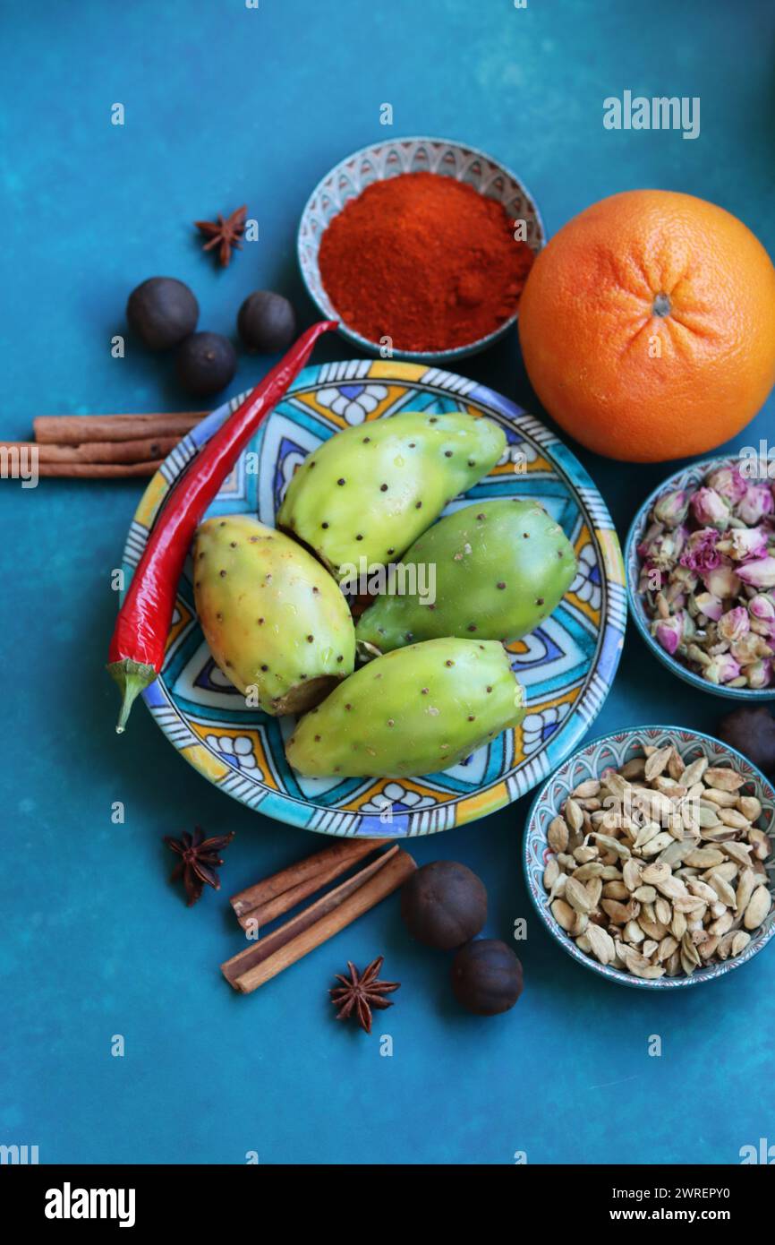 Still life with colorful fruit and spices on a table. Top view photo of ...