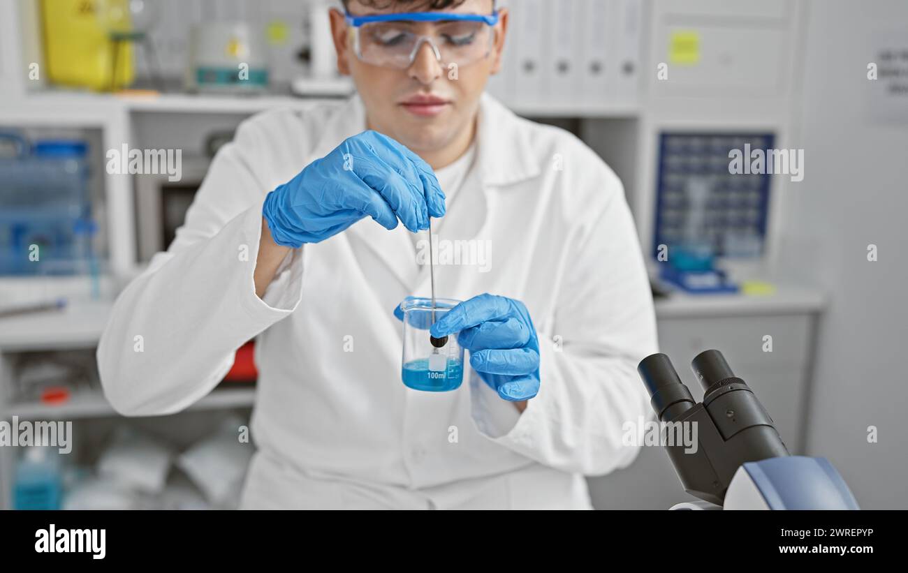 Scientist mixing chemicals hi-res stock photography and images - Alamy
