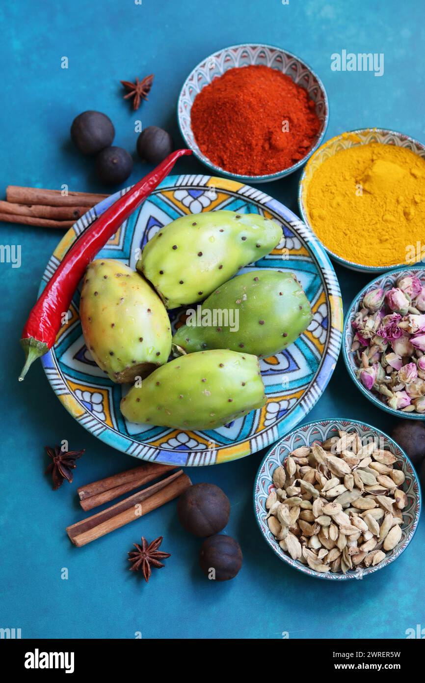 Still life with colorful fruit and spices on a table. Top view photo of ...