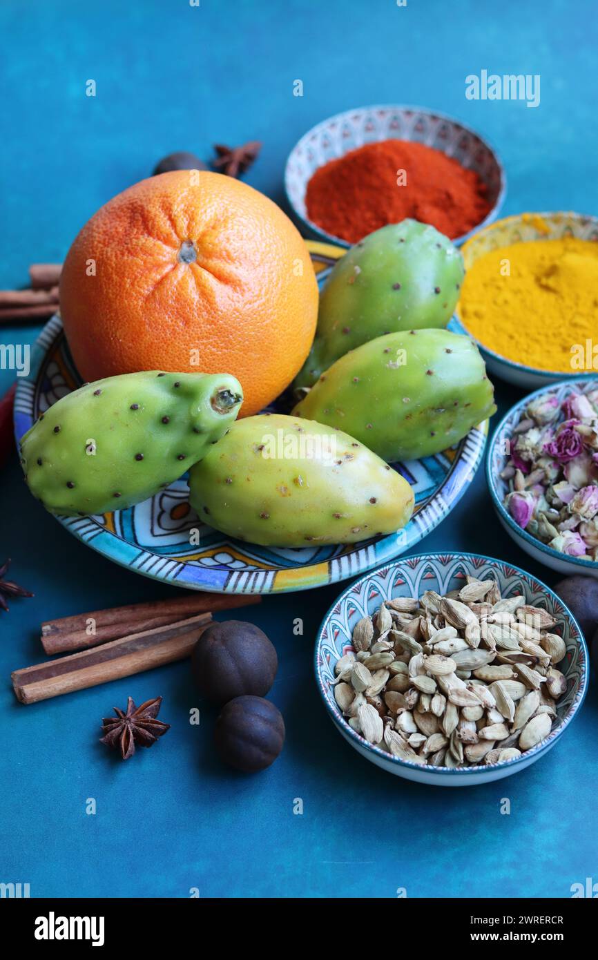 Still life with colorful fruit and spices on a table. Top view photo of ...