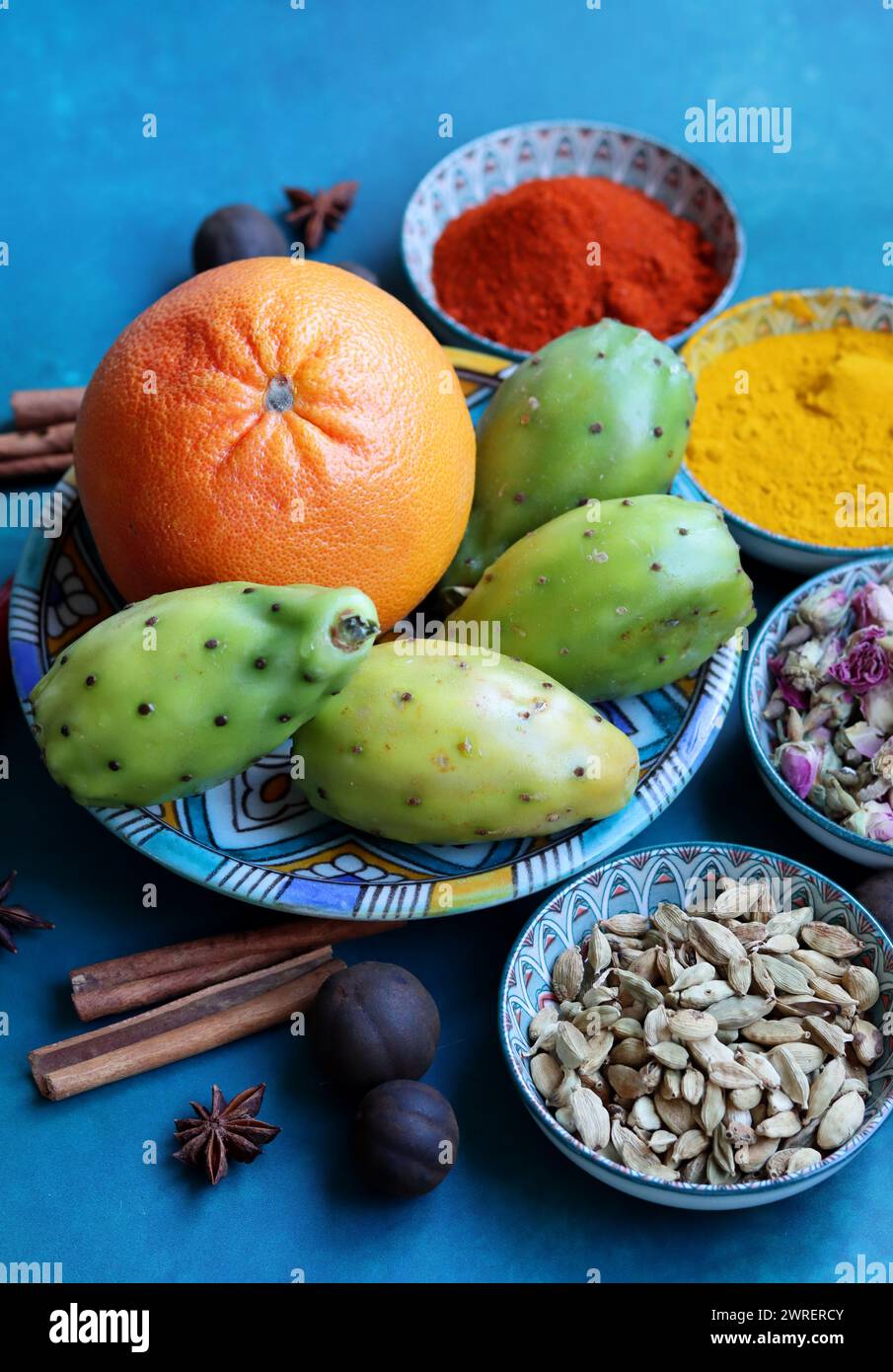 Still life with colorful fruit and spices on a table. Top view photo of ...