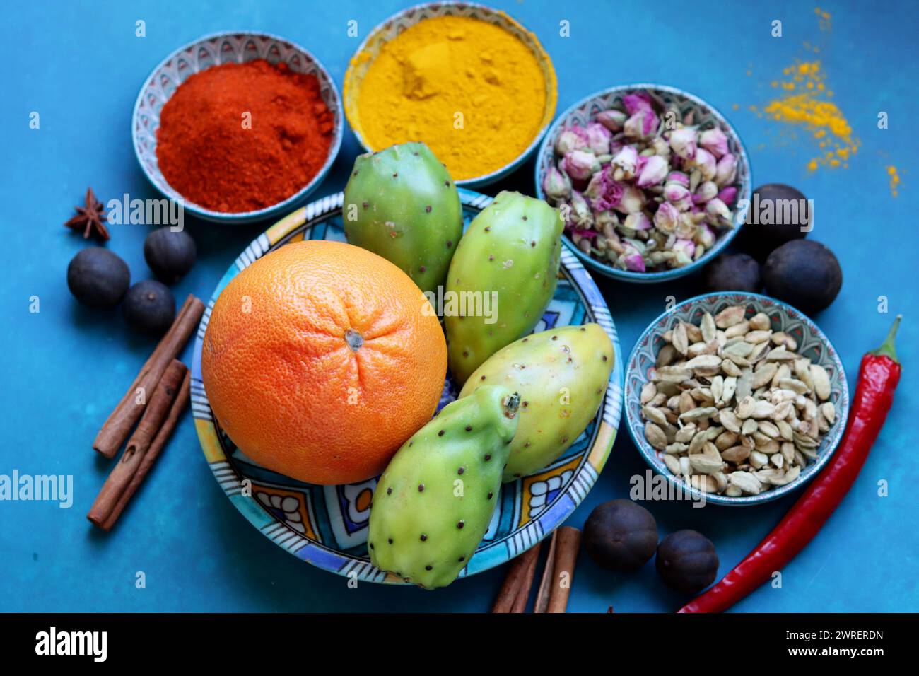 Still life with colorful fruit and spices on a table. Top view photo of ...