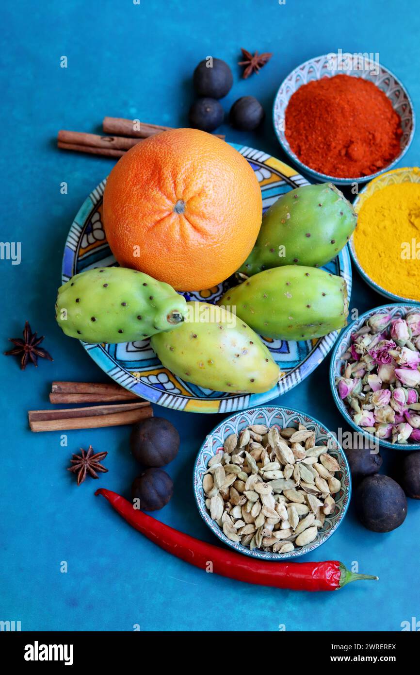 Still life with colorful fruit and spices on a table. Top view photo of ...