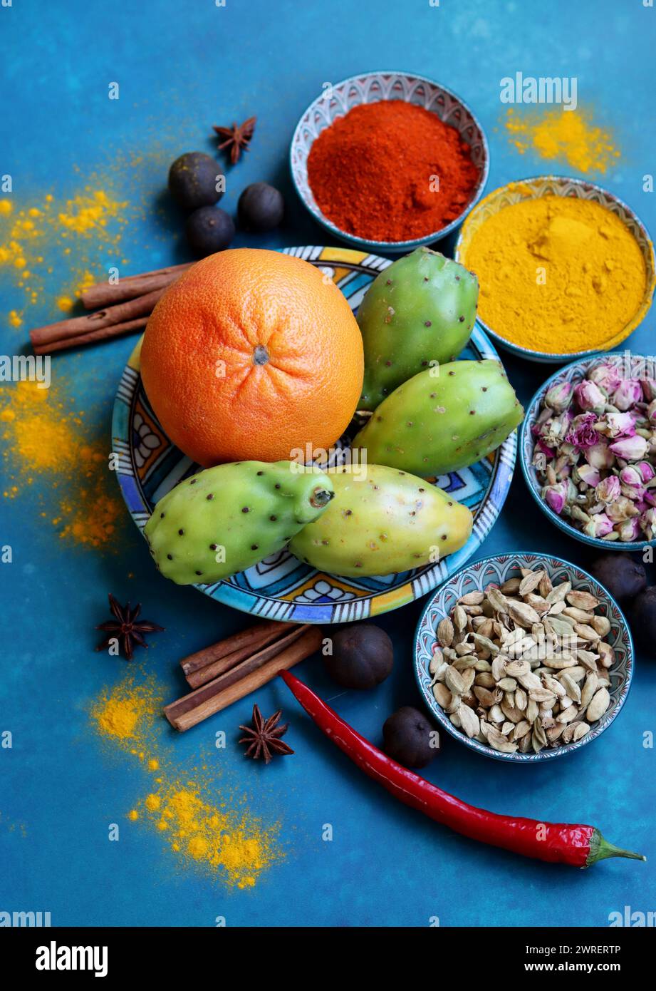 Still life with colorful fruit and spices on a table. Top view photo of ...