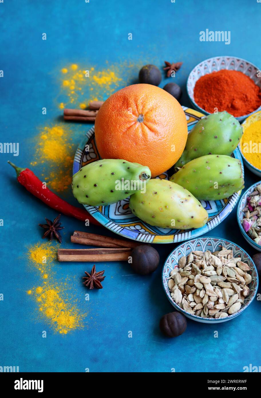 Still life with colorful fruit and spices on a table. Top view photo of ...