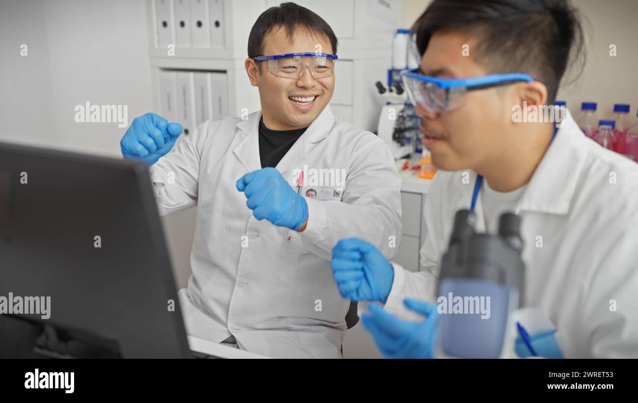 Biology laboratory scientists collaborating microscope hi-res stock ...