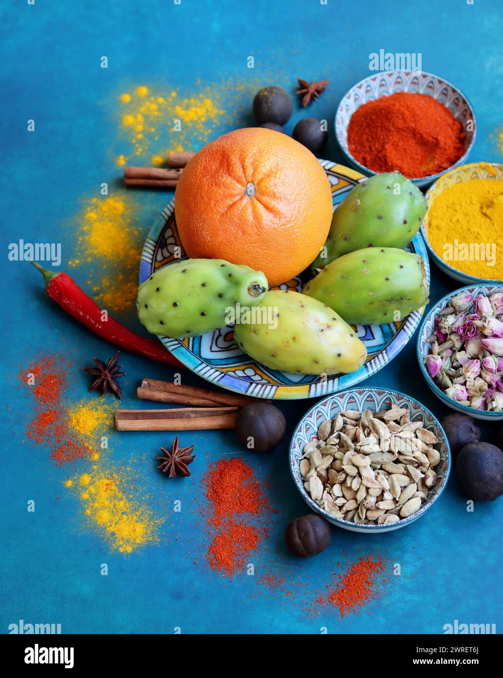 Still life with colorful fruit and spices on a table. Top view photo of ...
