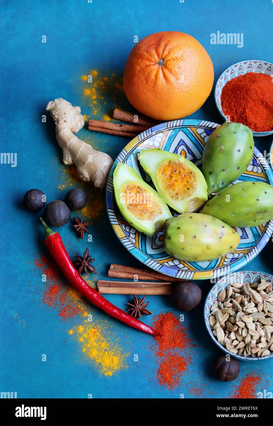 Still life with colorful fruit and spices on a table. Top view photo of ...
