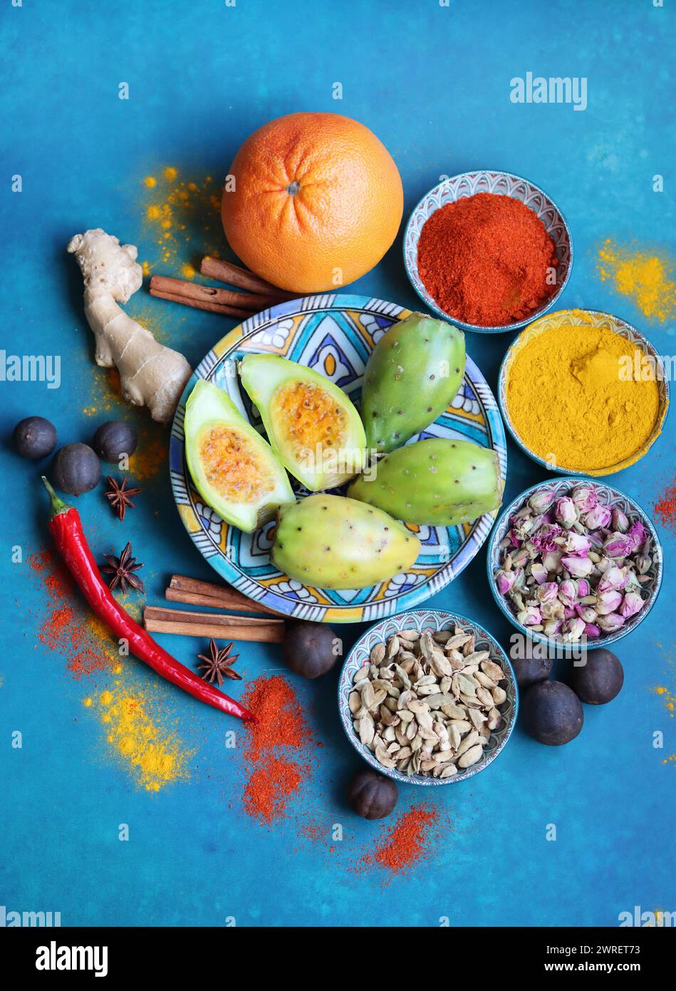 Still life with colorful fruit and spices on a table. Top view photo of ...
