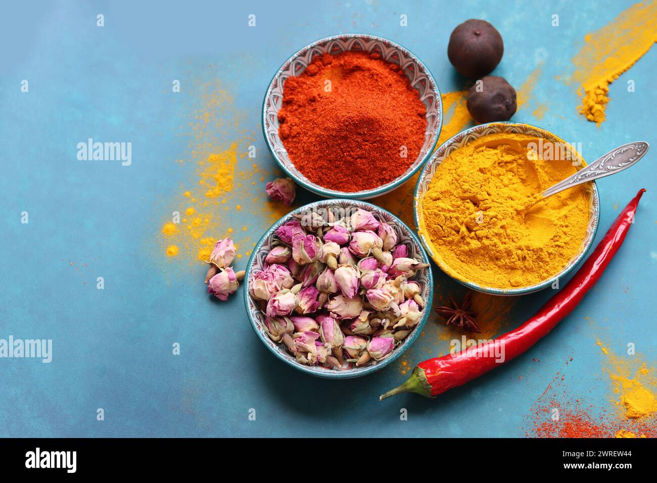 Still life with different spices on blue background with copy space ...
