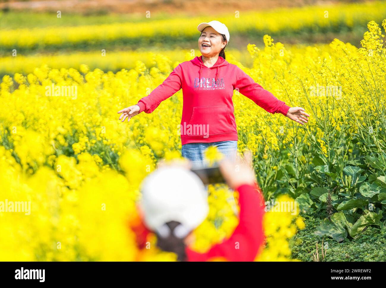 Liupanshui, China's Guizhou Province. 12th Mar, 2024. A tourist poses ...