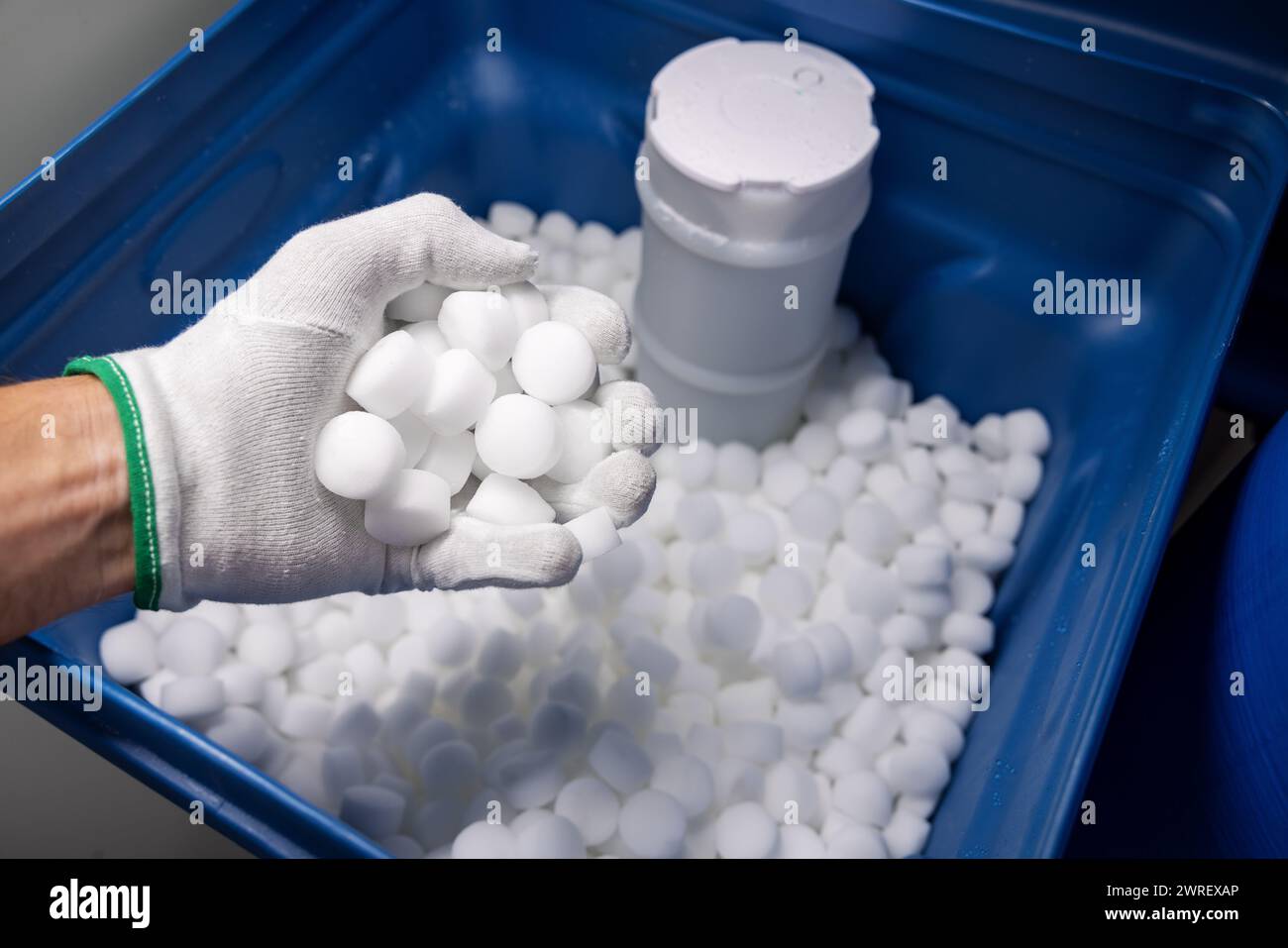 filling water softener with salt tablets Stock Photo - Alamy