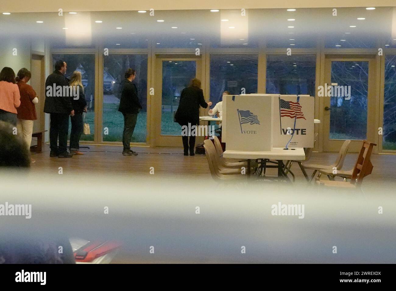 Voters line up to cast their ballots shortly after this north Jackson ...