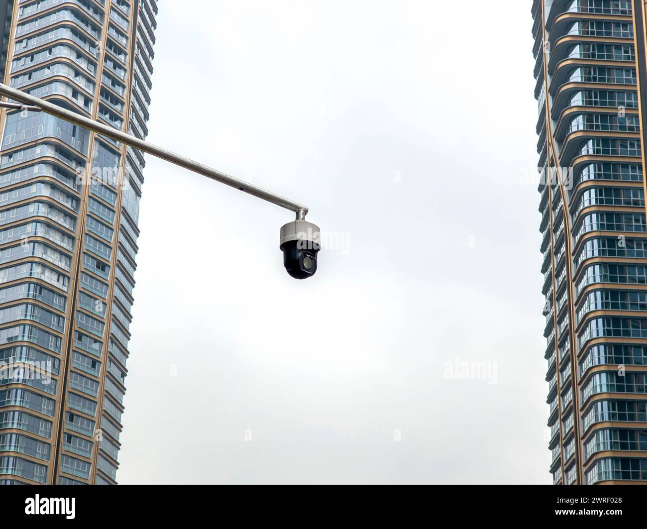 modern cctv camera hanging over modern residential building ...
