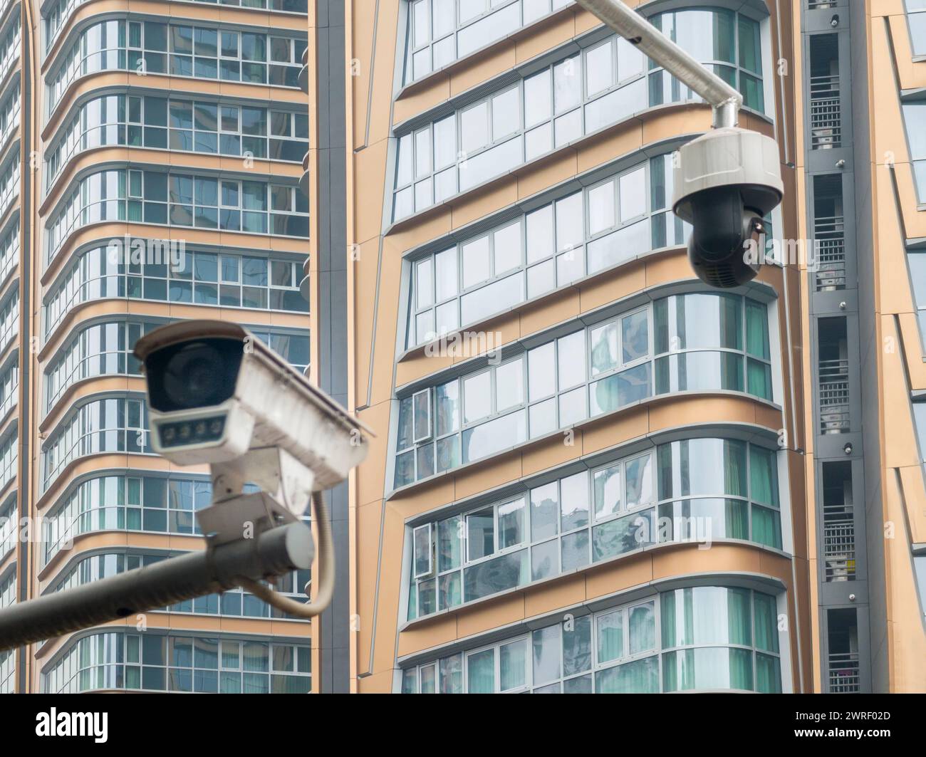 modern cctv camera hanging over modern residential building ...