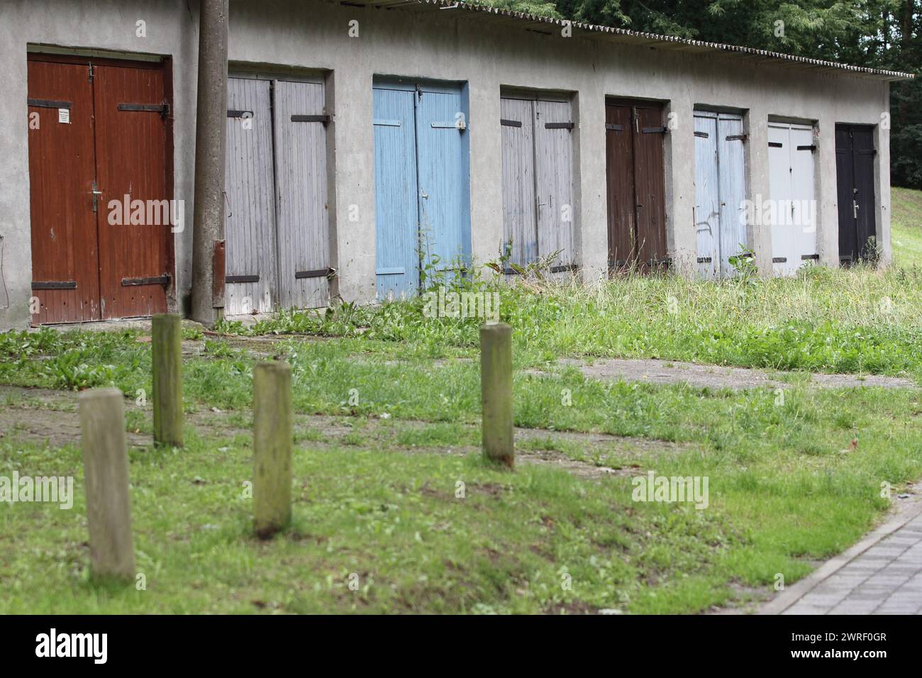 Flat elongated building with many differently colored doors Stock Photo ...