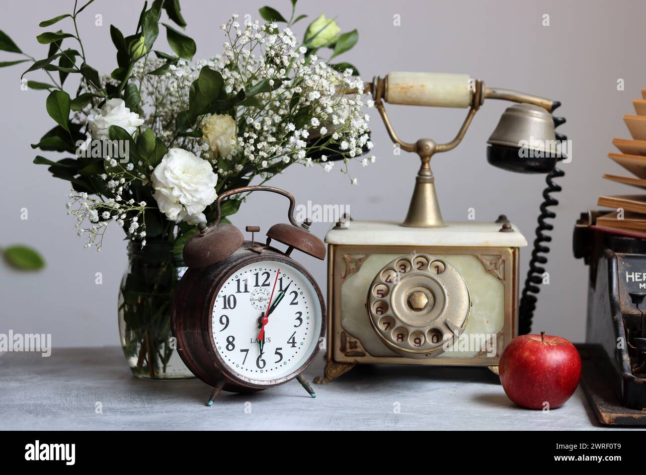 Vintage rotary telephone on a desk. Still life with retro phone. Bright ...