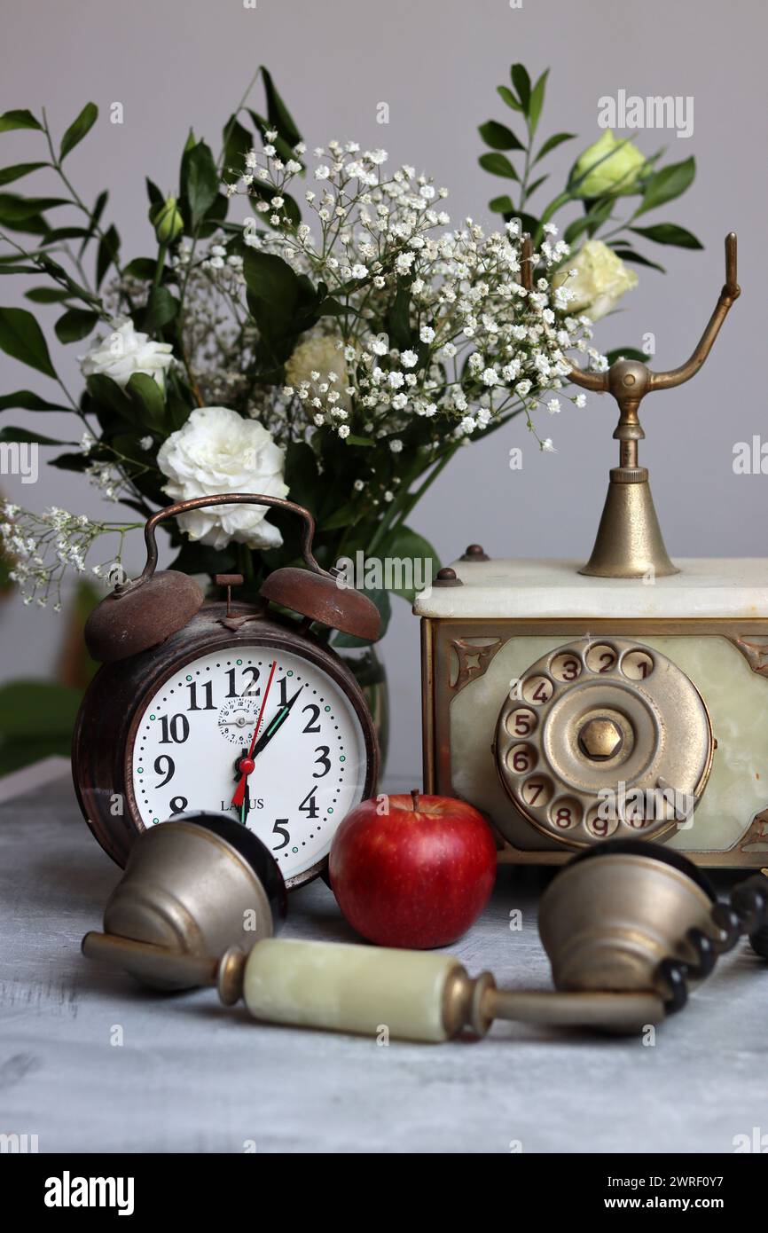 Vintage rotary telephone on a desk. Still life with retro phone. Bright ...