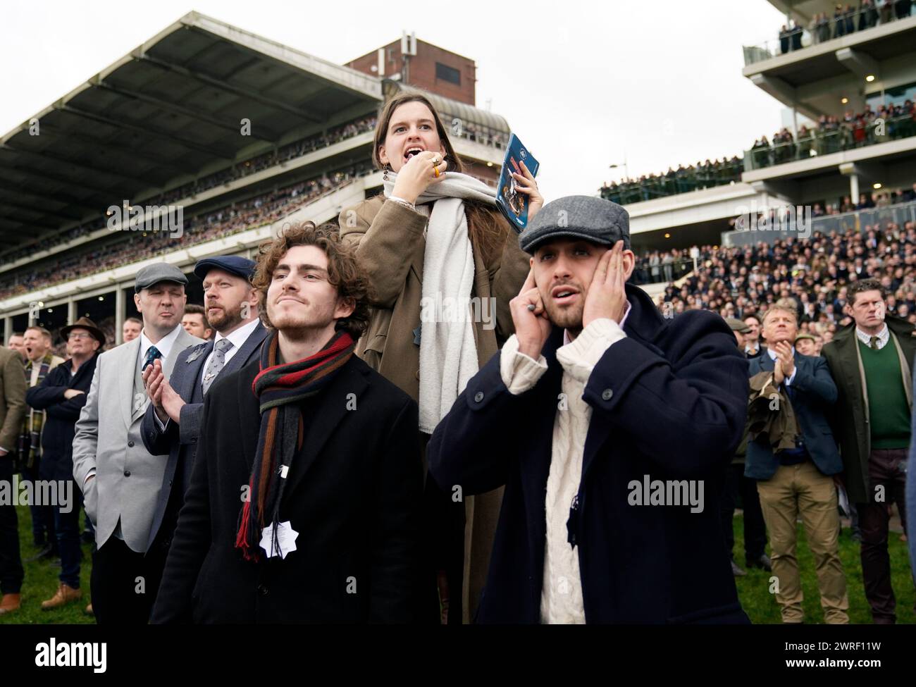 Racegoers watch the action on day one of the 2024 Cheltenham Festival ...