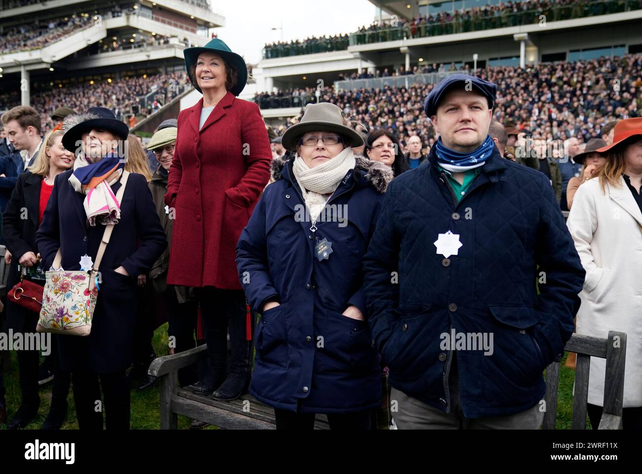 Racegoers watch the action on day one of the 2024 Cheltenham Festival ...