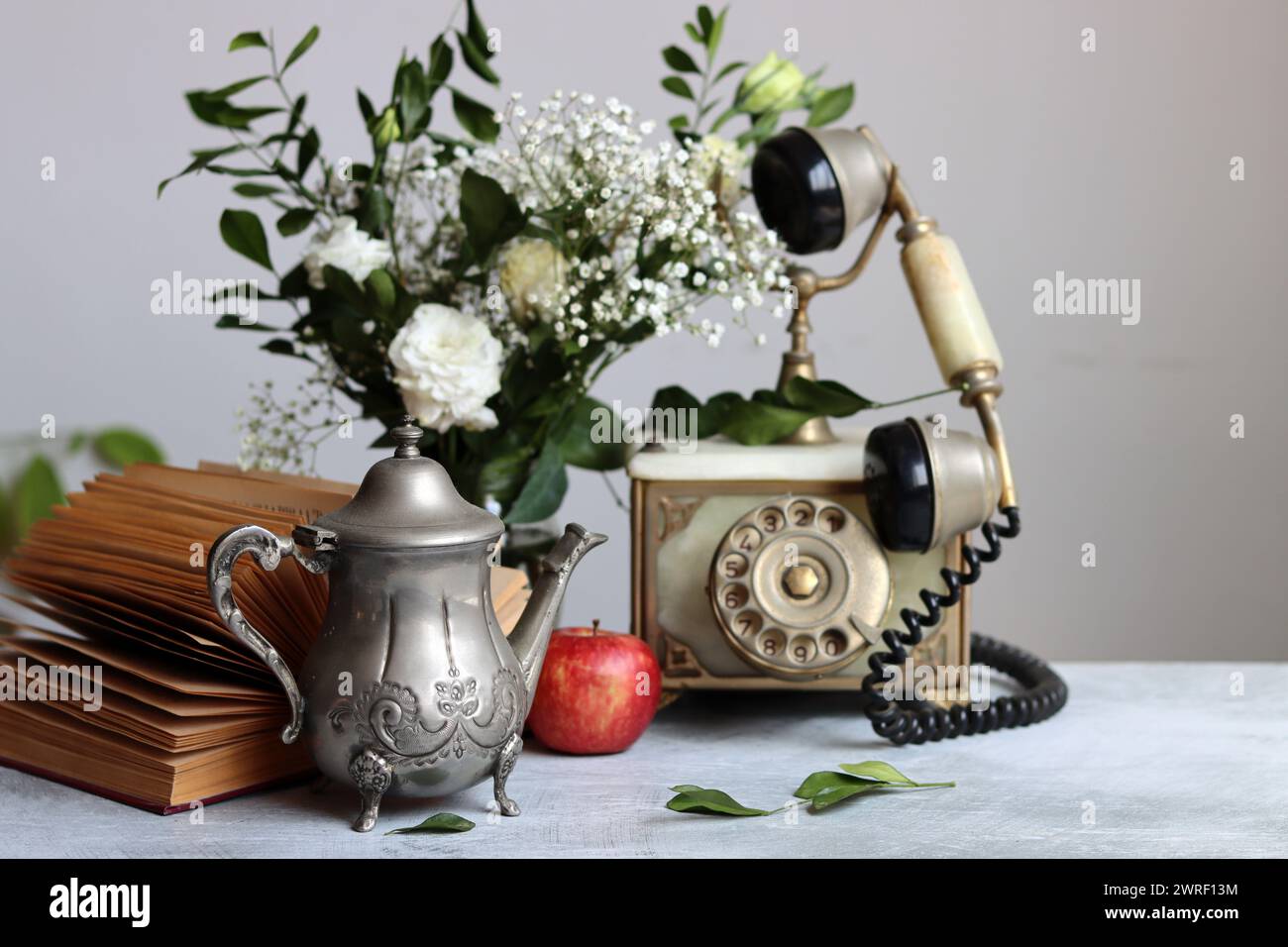 Vintage rotary telephone on a desk. Still life with retro phone. Bright ...
