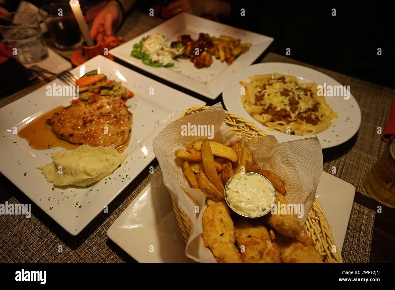 Close up Fish and chips with cheesy pasta and pork steak Stock Photo ...