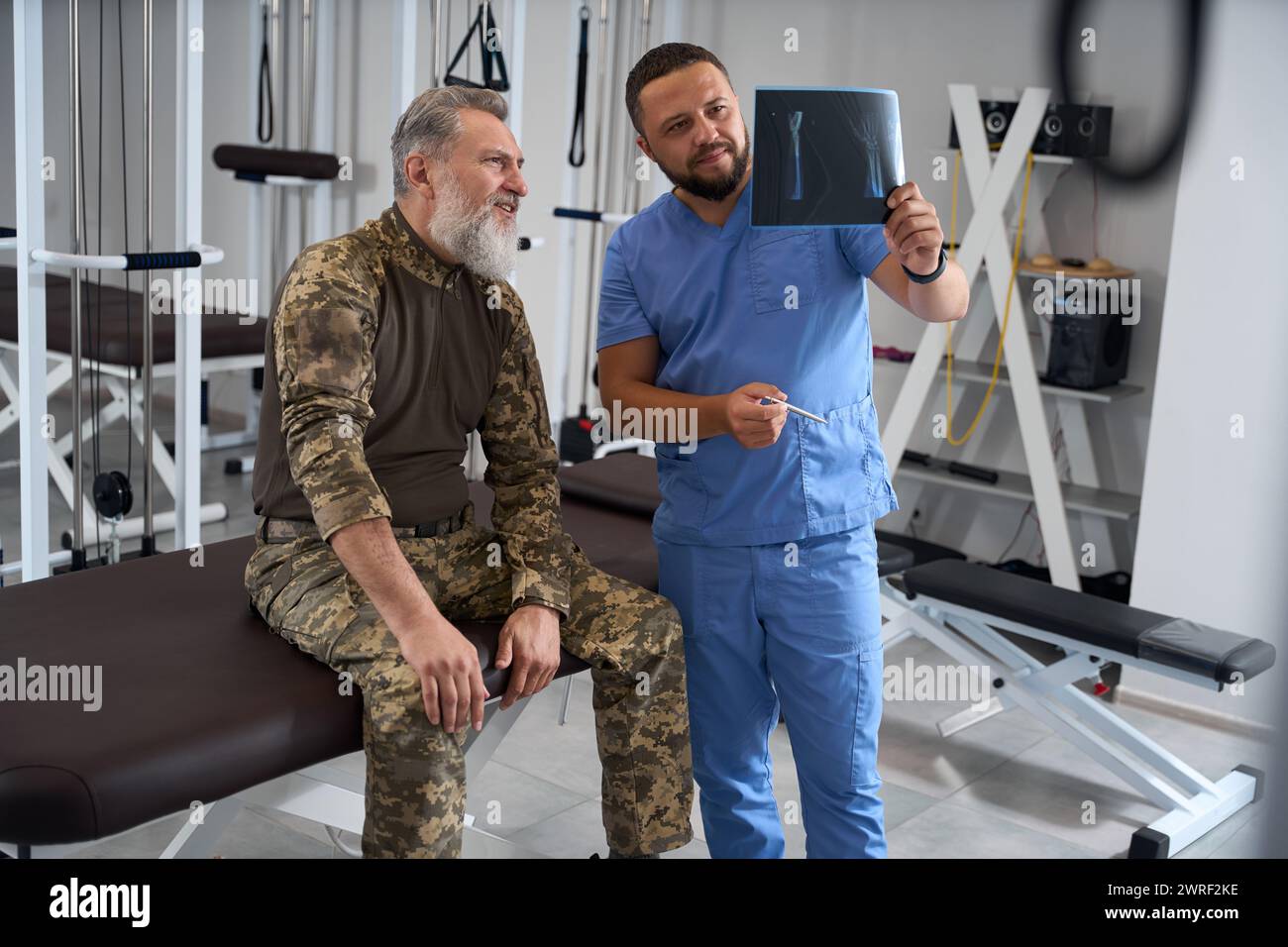 Bearded men in the gym looking at x-rays Stock Photo - Alamy