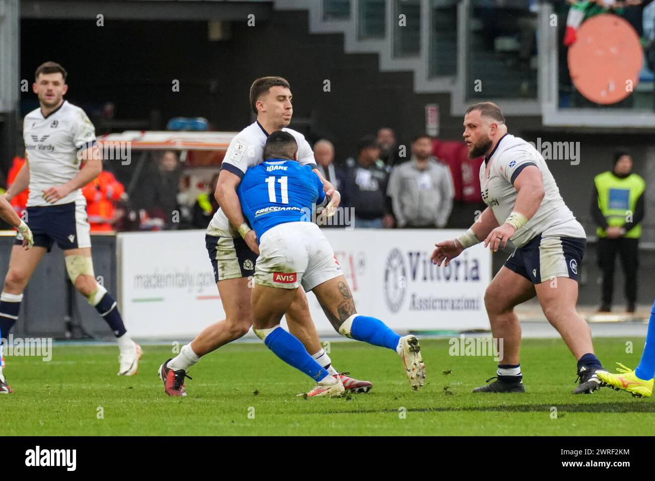 Monty Ioane of Italy is tackled by Finn Russell of Scotland during the ...