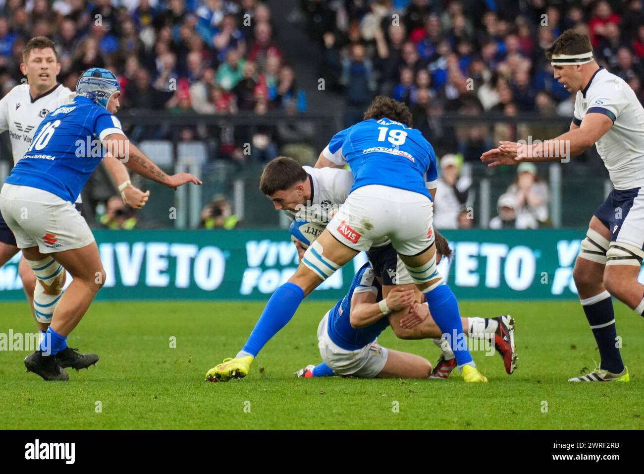 Finn Russell of Scotland is tackled by Andrea Zambonin of Italy during ...