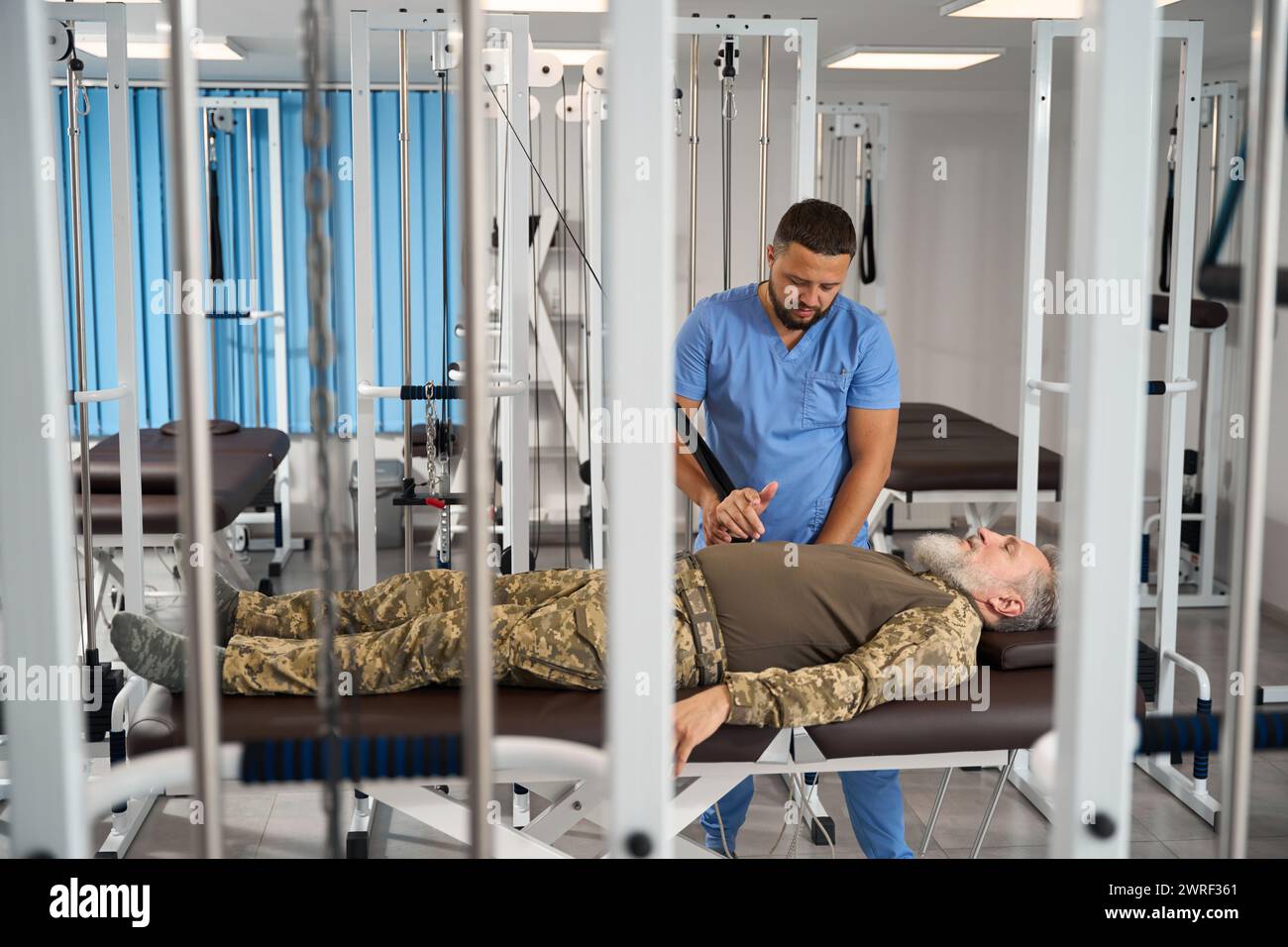 Military patient does exercises to stretch his arm muscles Stock Photo ...
