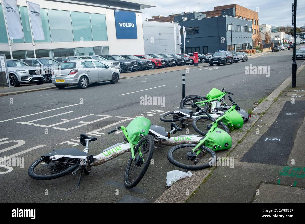 LONDON- FEBRUARY 4, 2024: Lime rental bikes lying on the road, a common ...