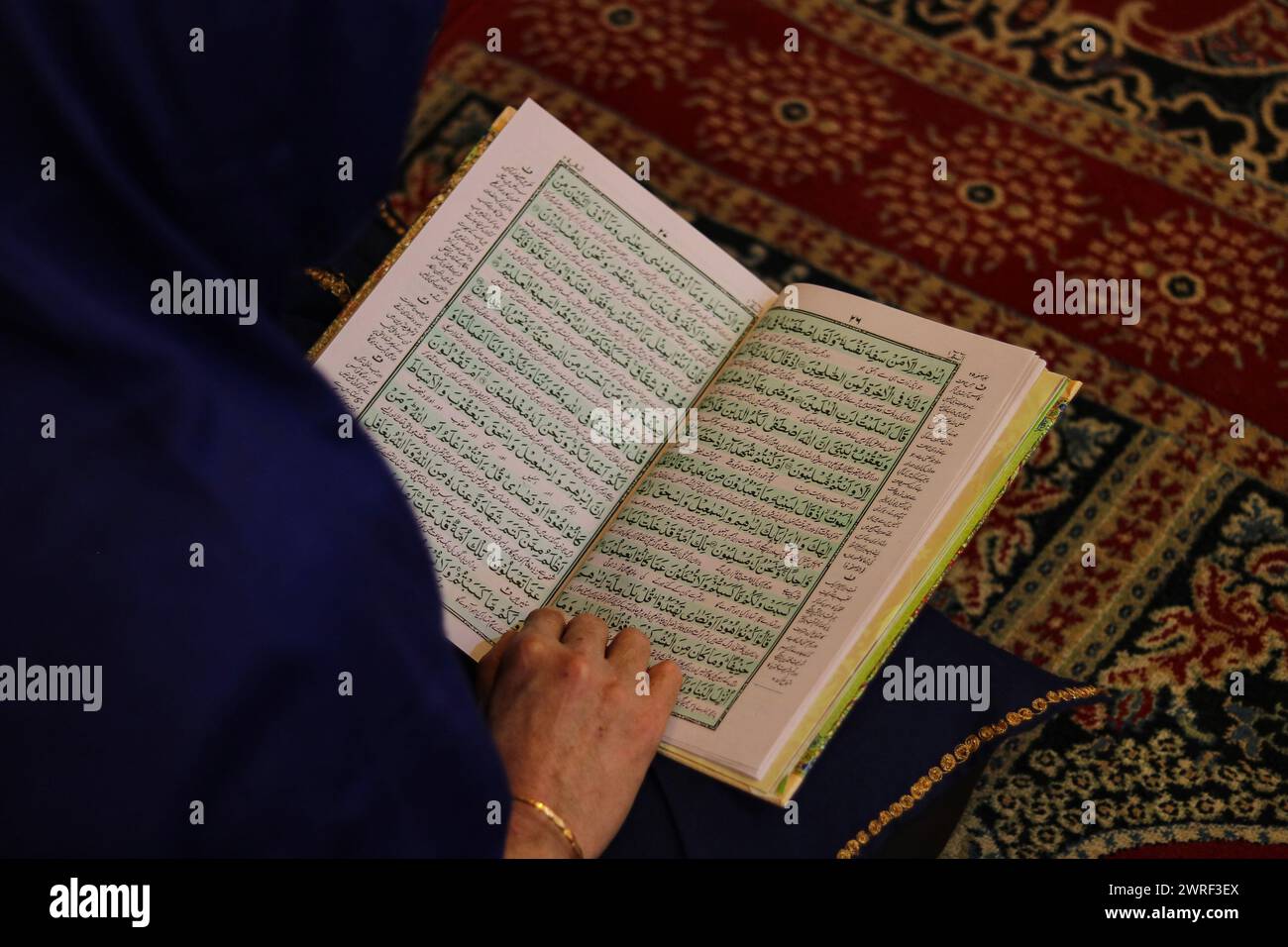 Woman recites from the holy quran hi-res stock photography and images ...