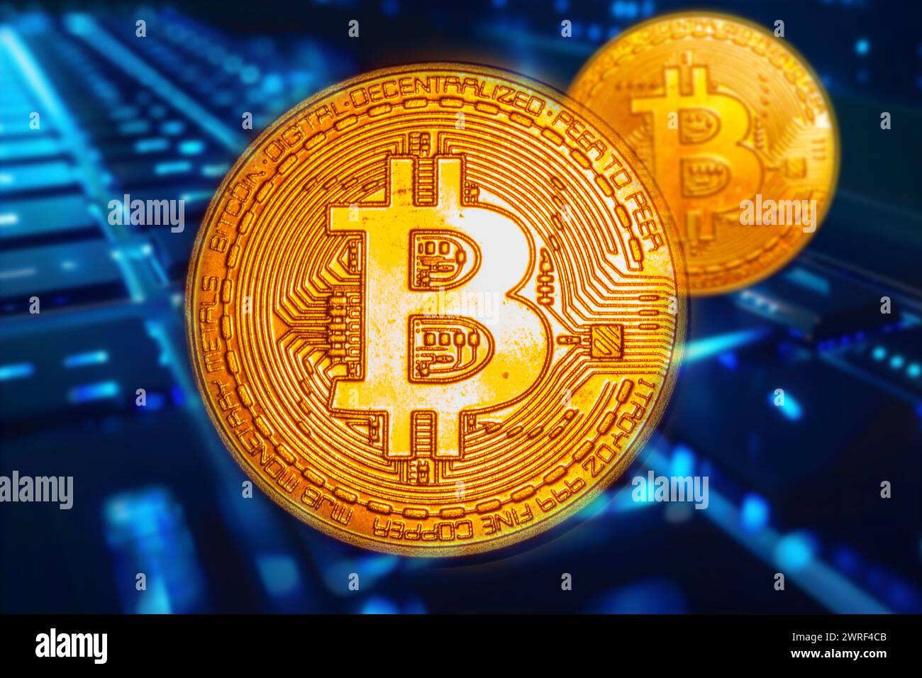 Close-up of a symbolic Bitcoin in front of a virtual background ...