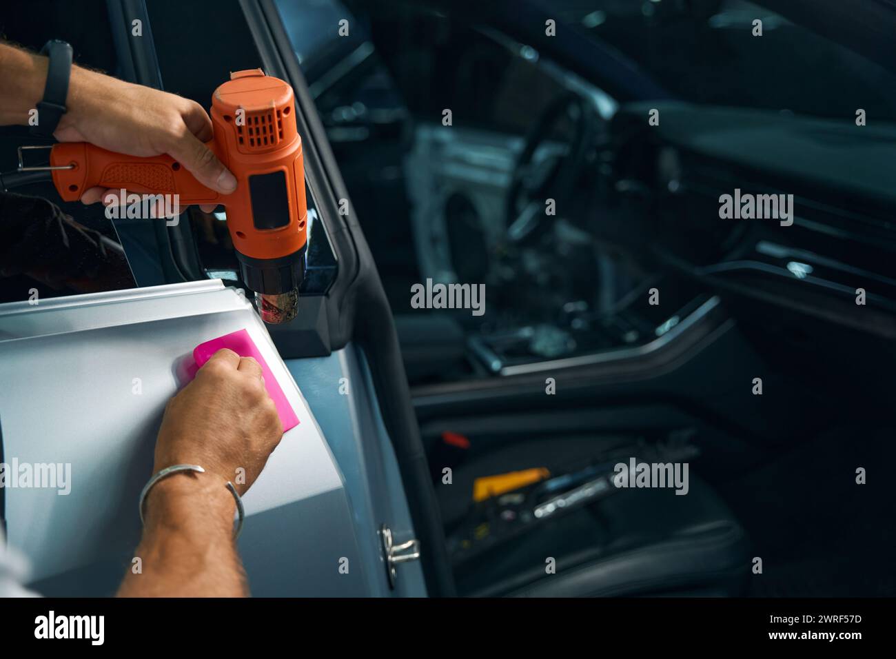 Using a powerful industrial dryer when detailing a car Stock Photo - Alamy