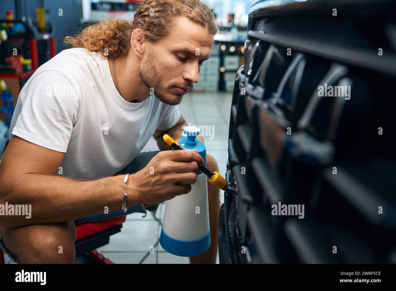 Process of car detailing in an auto repair shop Stock Photo - Alamy
