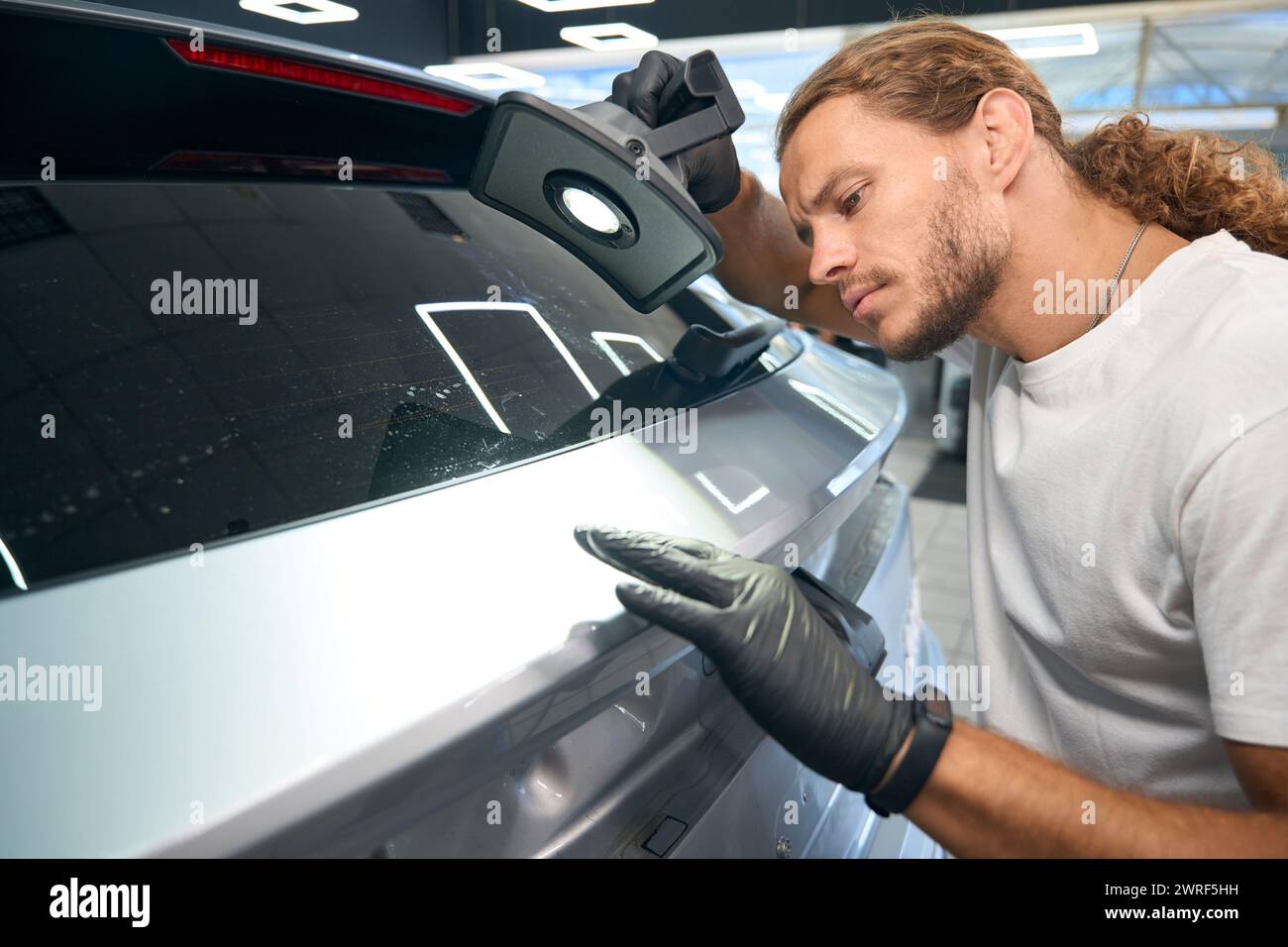 Specialist conducts a check inspection of the car body Stock Photo - Alamy