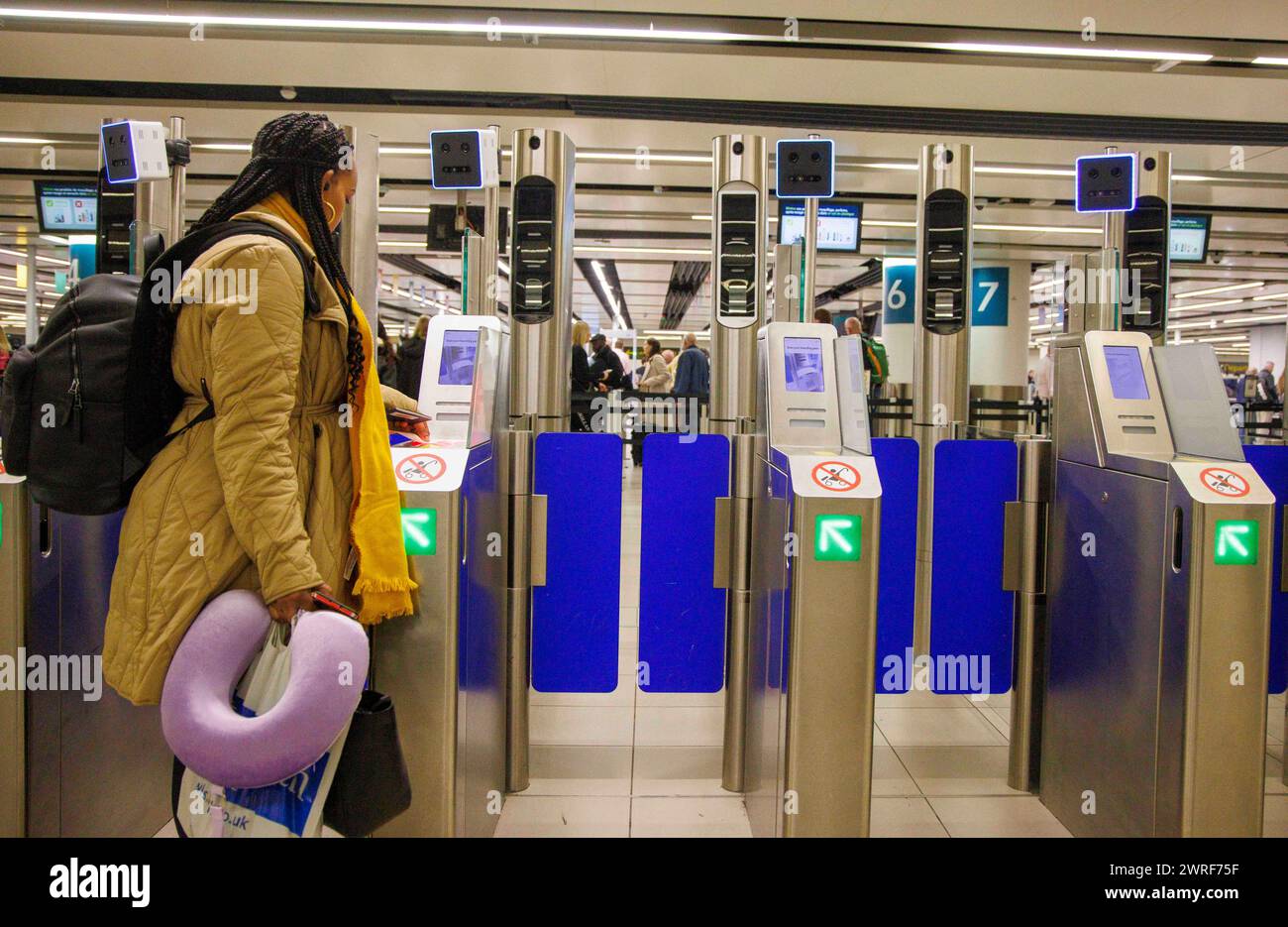 Passengers at the Departure Gates at Gatwick airport Stock Photo - Alamy