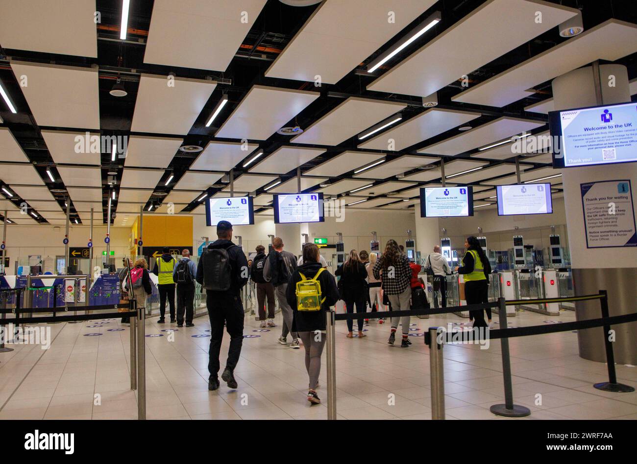 Arrivals at the passport gates at Gatwick Airport where biometric ...
