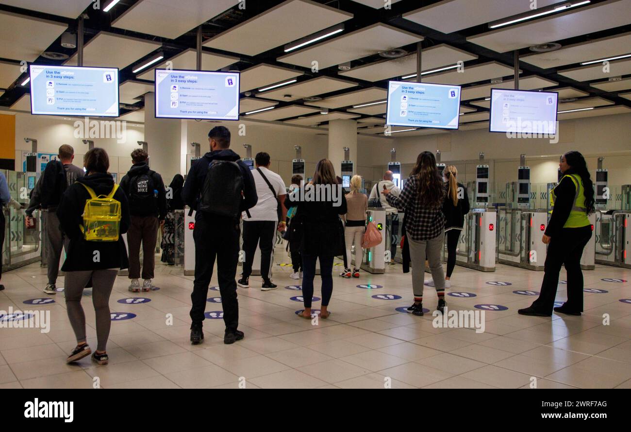 Arrivals at the passport gates at Gatwick Airport where biometric ...