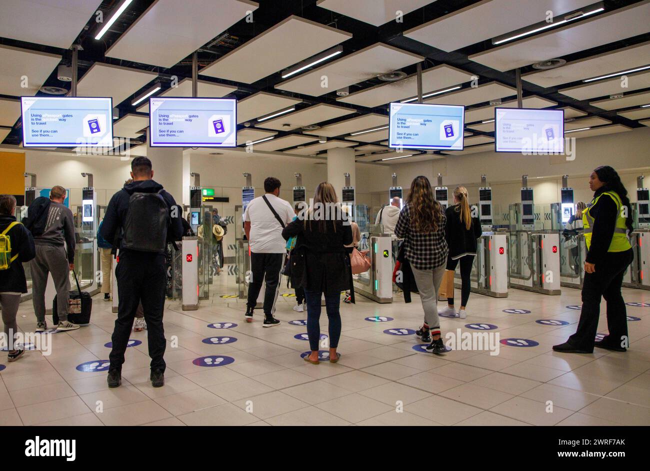 Arrivals at the passport gates at Gatwick Airport where biometric ...