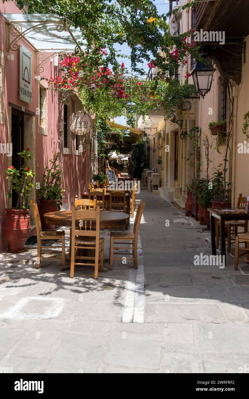 Pavement cafes are a typical street scene in old town Rethyymnon, Crete ...