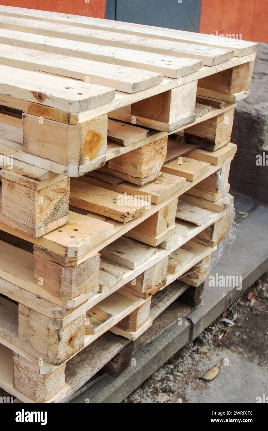 Wooden pallets against the wall of the store Stock Photo - Alamy