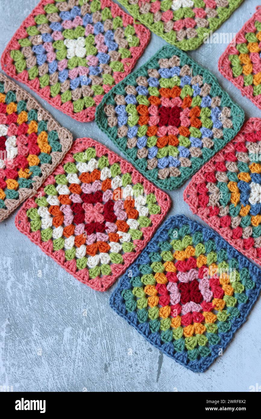 Handmade crocheted zigzag ornaments on grey background with copy space ...