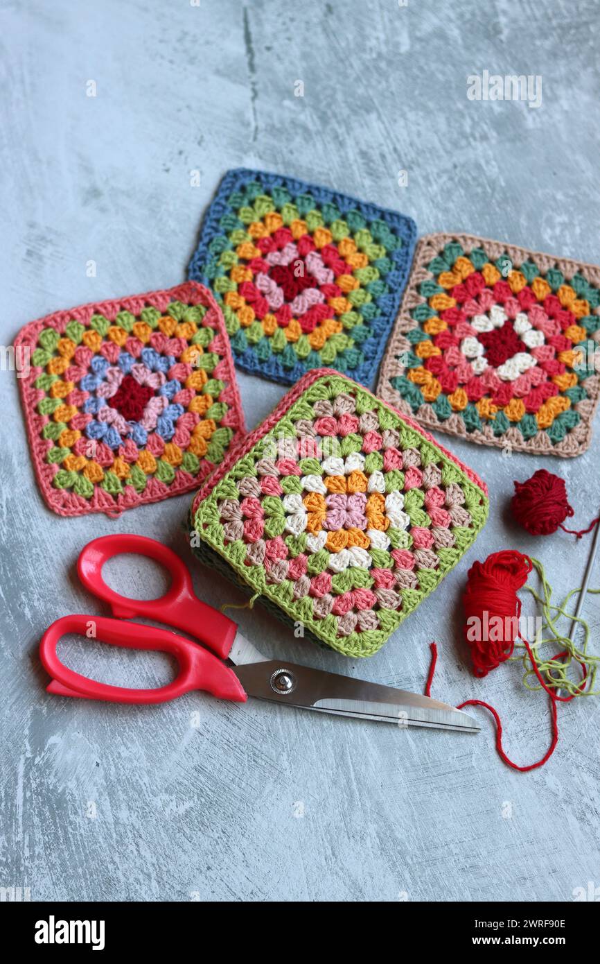 Handmade crocheted zigzag ornaments on grey background with copy space ...