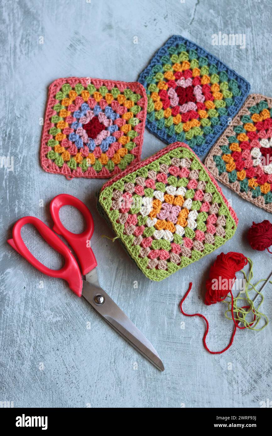 Crochet project in making. Colorful crochet squares close up photo ...