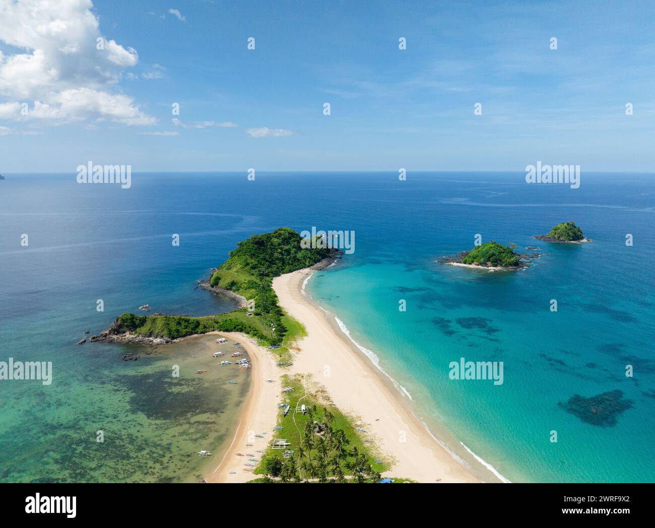 Tropical sandy beach with inshore waves. Nacpan Beach. El Nido ...