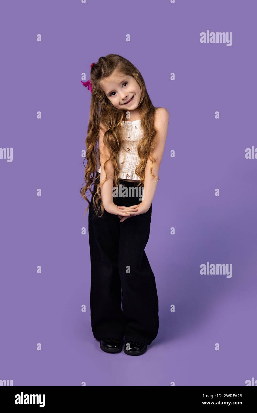 The picture of a girl dressed very nicely and stylishly is photographed ...