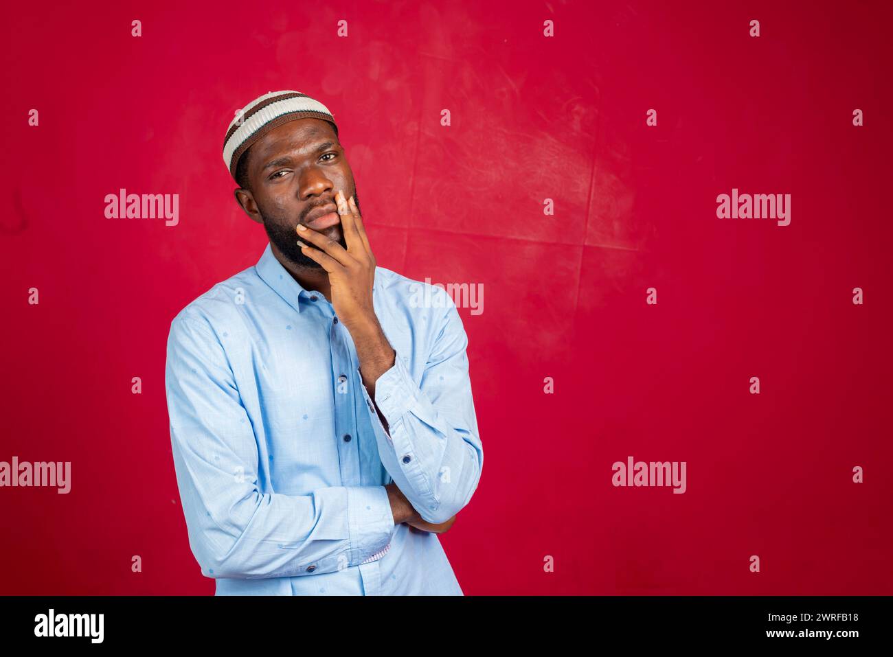 African muslim man making traditional hi-res stock photography and ...