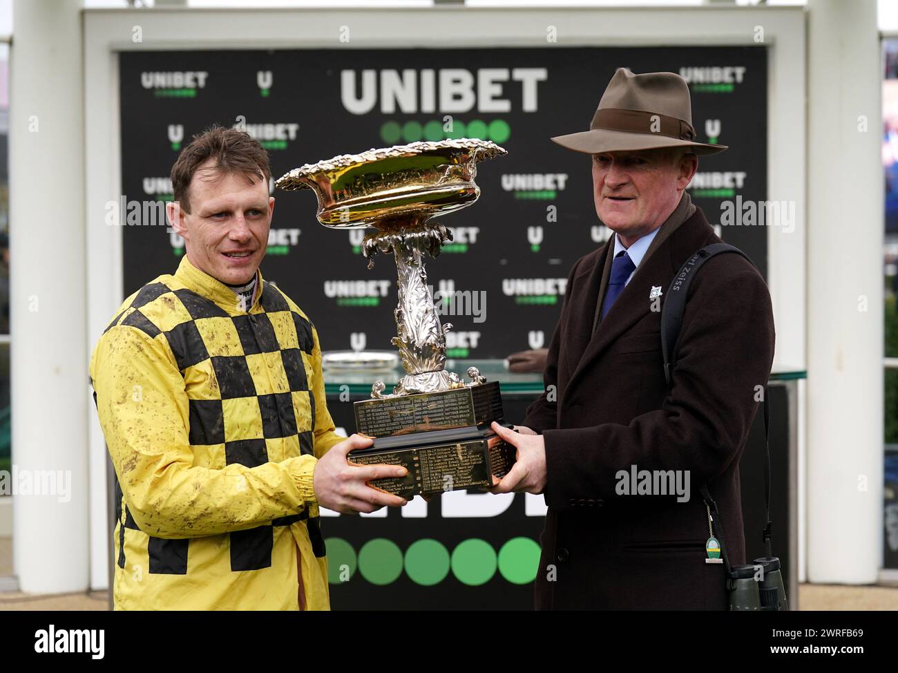 Paul Townend and trainer Willie Mullins lift the trophy after winning ...