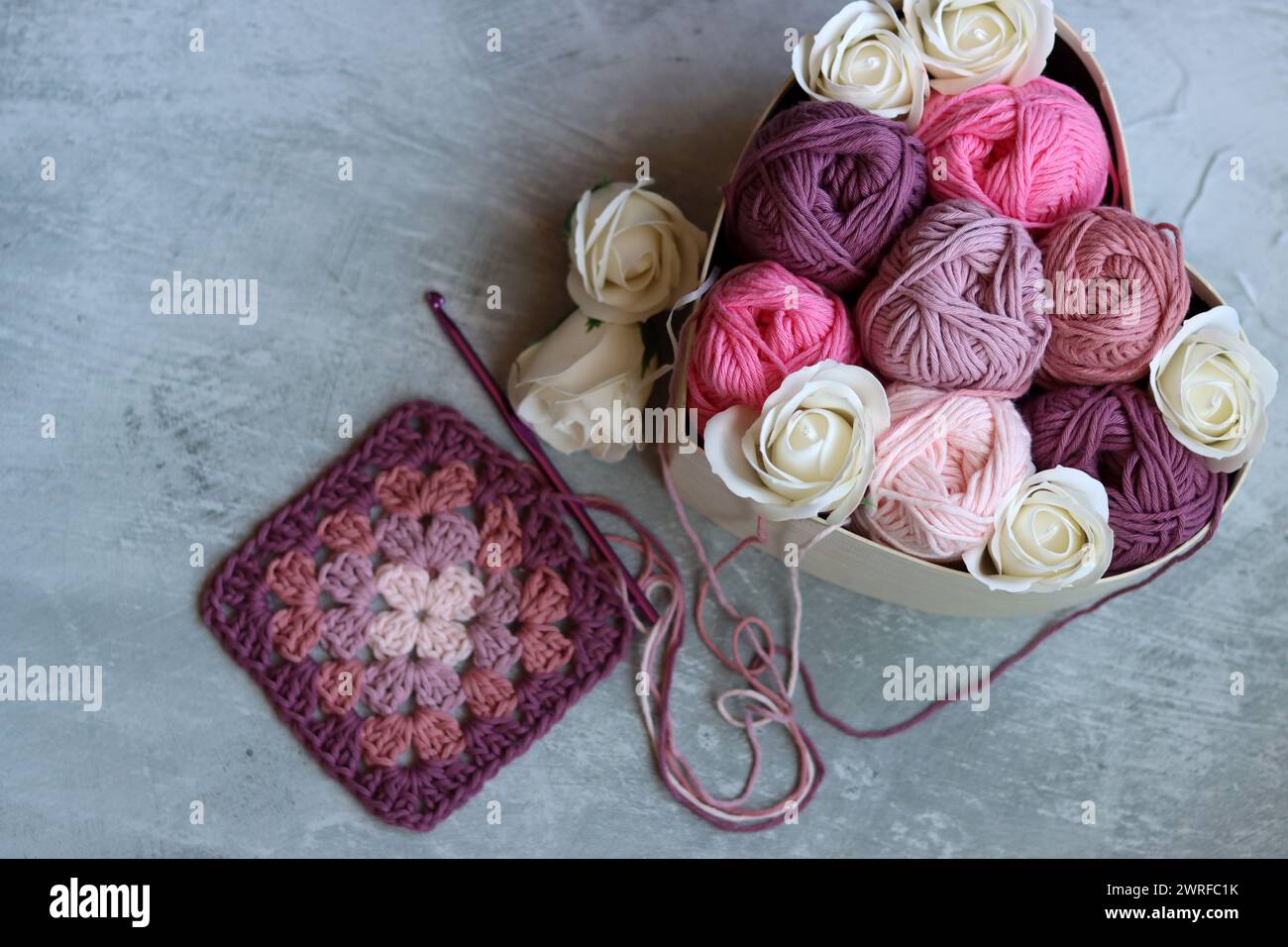 Granny square pattern made of soft organic cotton top view photo. Grey ...